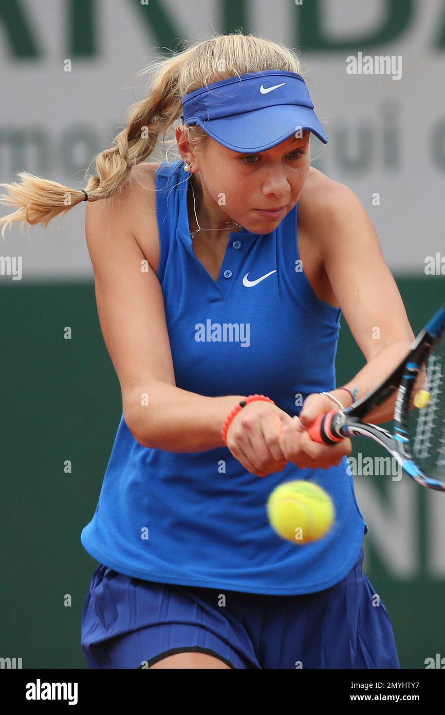 Amanda Anisimova of the U.S. returns the ball in the girl's final of ...