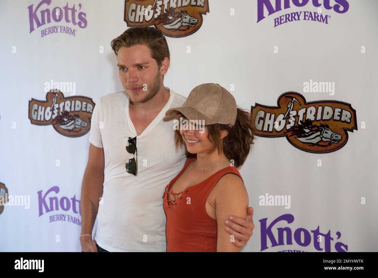 Dominic Sherwood, left, and Sarah Hyland arrive at the event to ...