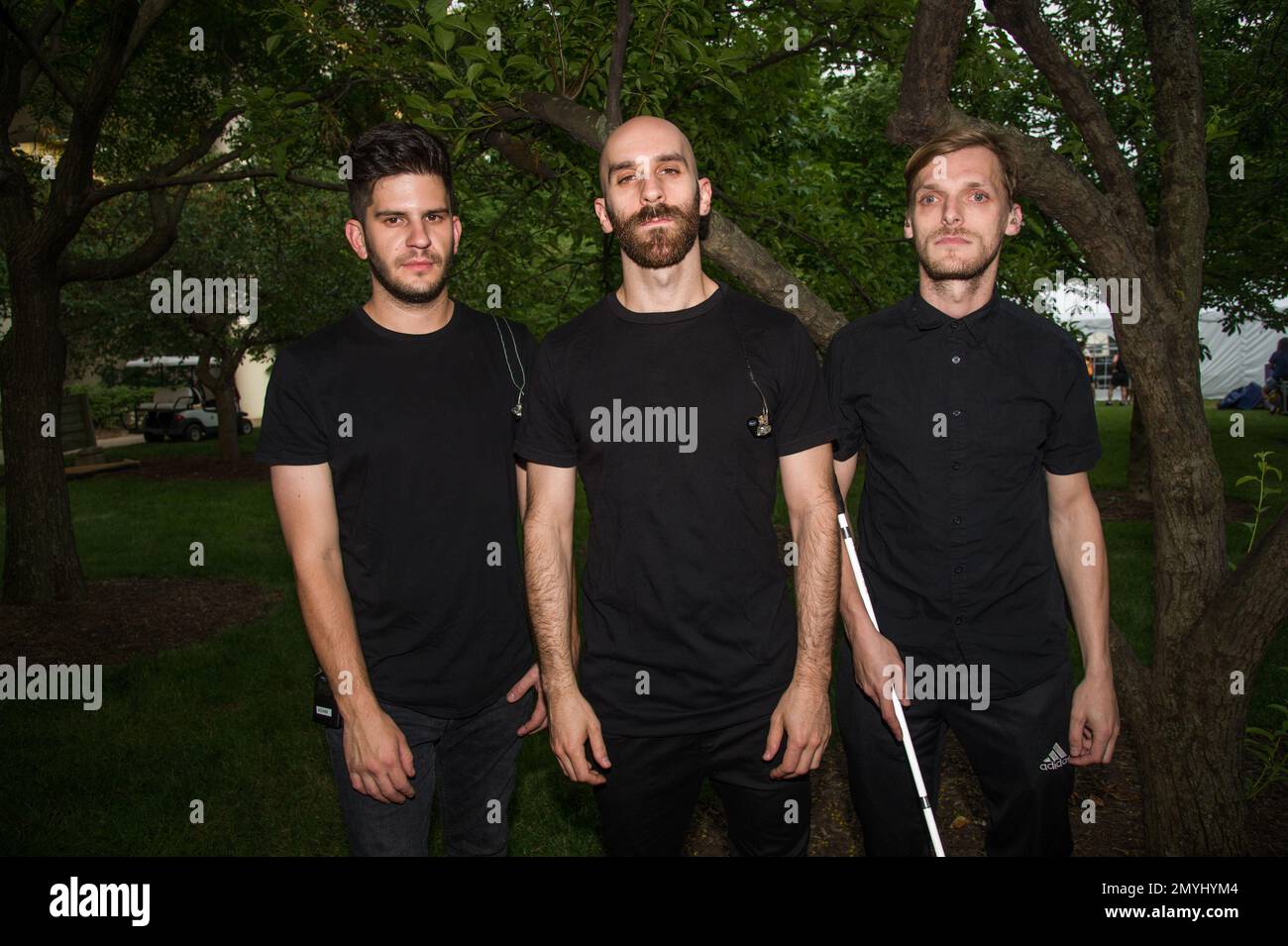 Adam Levin, left, Sam Harris, and Casey Harris of X Ambassadors pose at ...