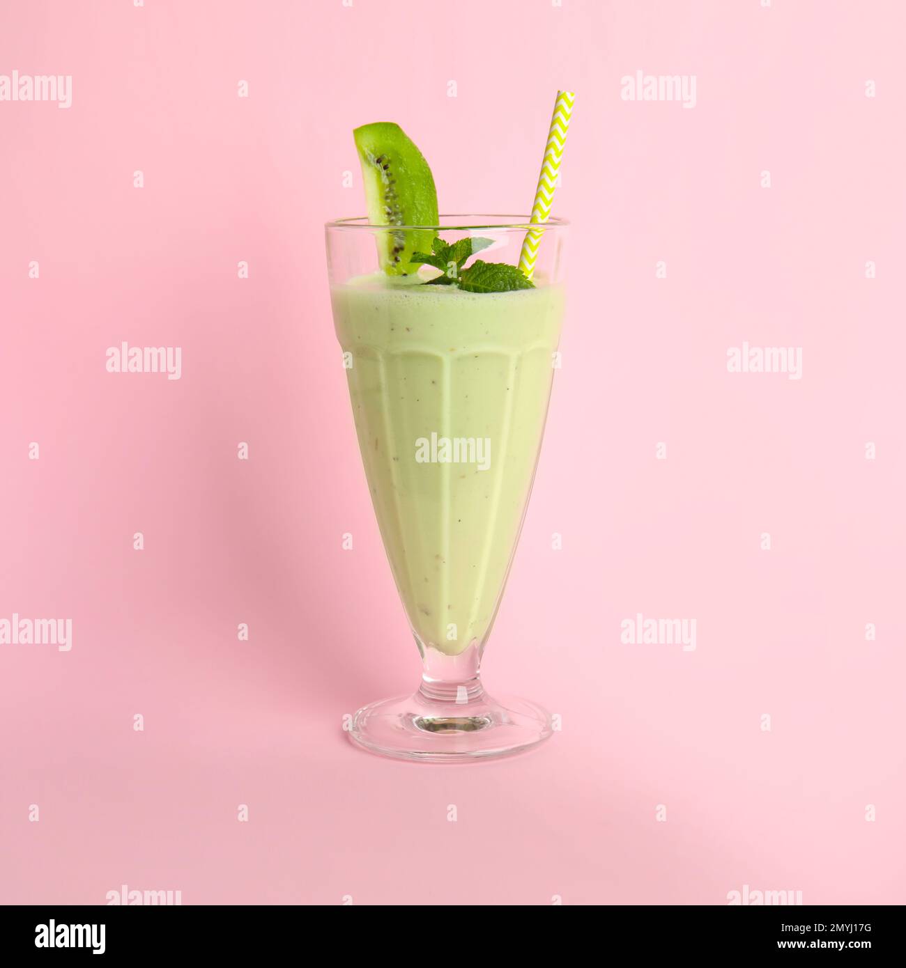 Tasty fresh milk shake with kiwi on pink background Stock Photo - Alamy