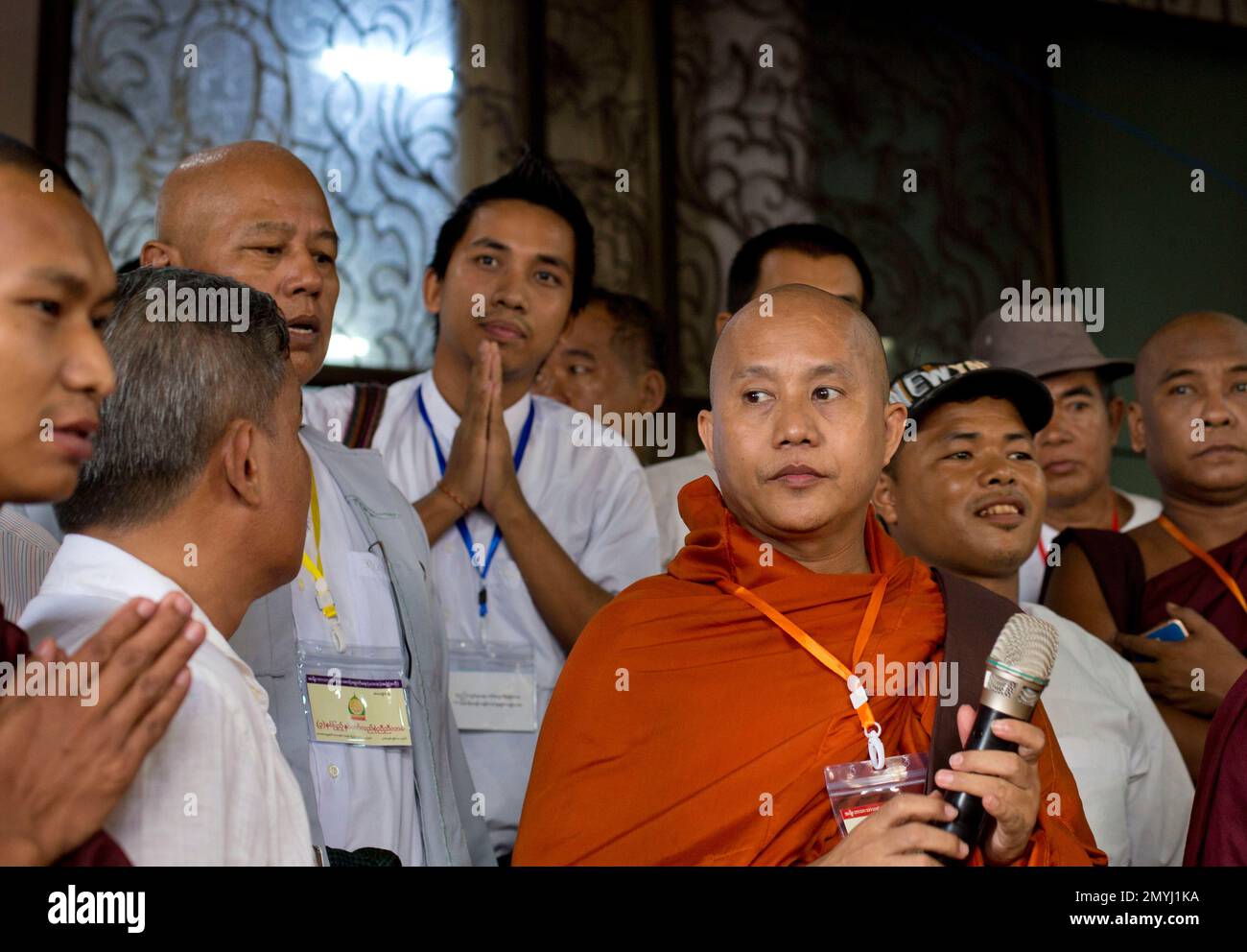 Controversial Buddhist monk Wirathu, holding a microphone, who is ...