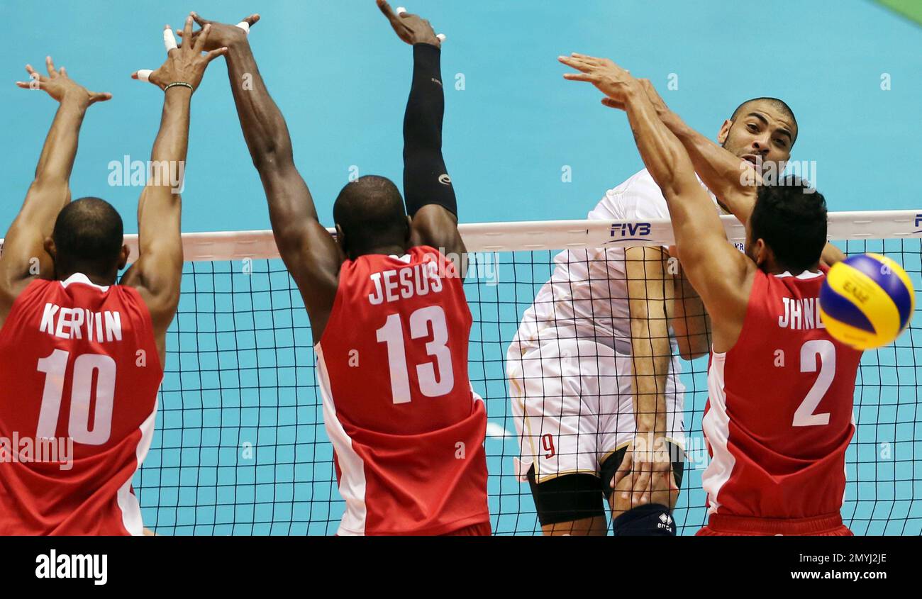 Earvin Ngapeth of France spikes the ball against Venezuela during their ...