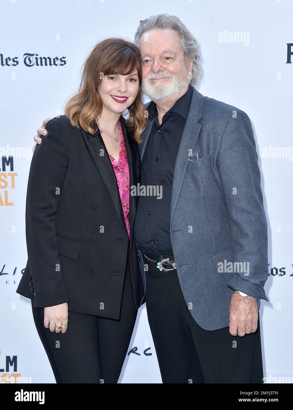 Amber Tamblyn, left, and Russ Tamblyn arrive at the premiere of "Paint ...