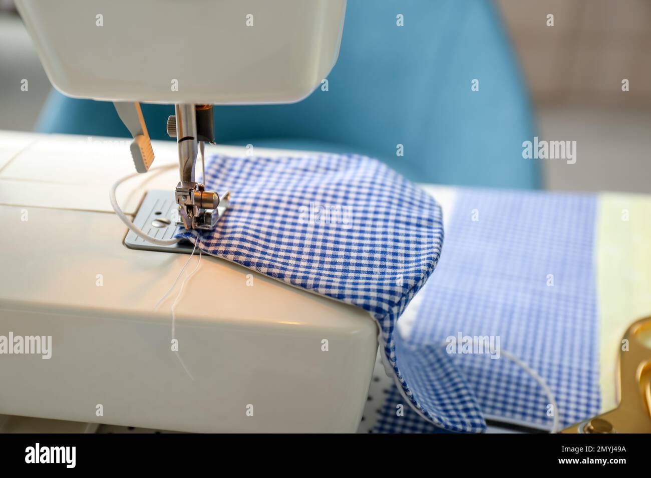 Sewing machine with cloth mask on table, closeup. Personal protective ...
