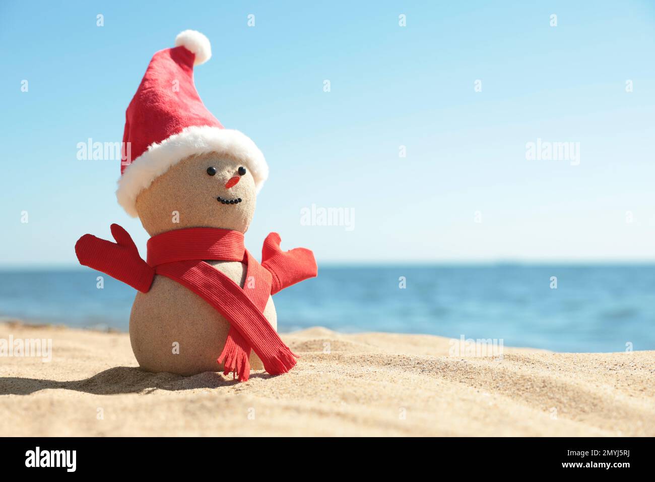 Snowman made sand on beach hi-res stock photography and images - Alamy