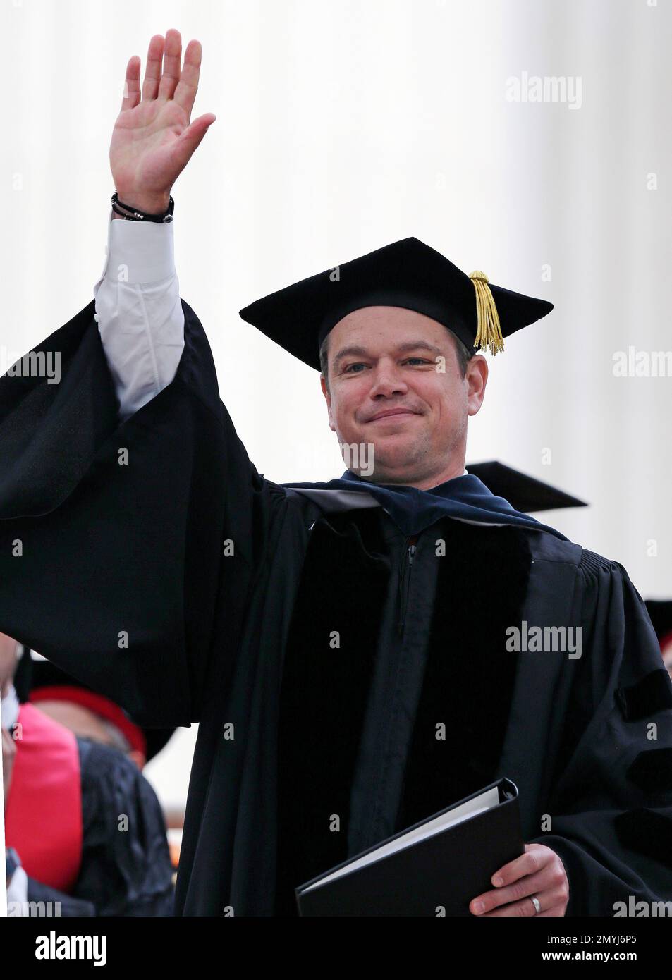 Actor Matt Damon waves to graduates following his address at the ...