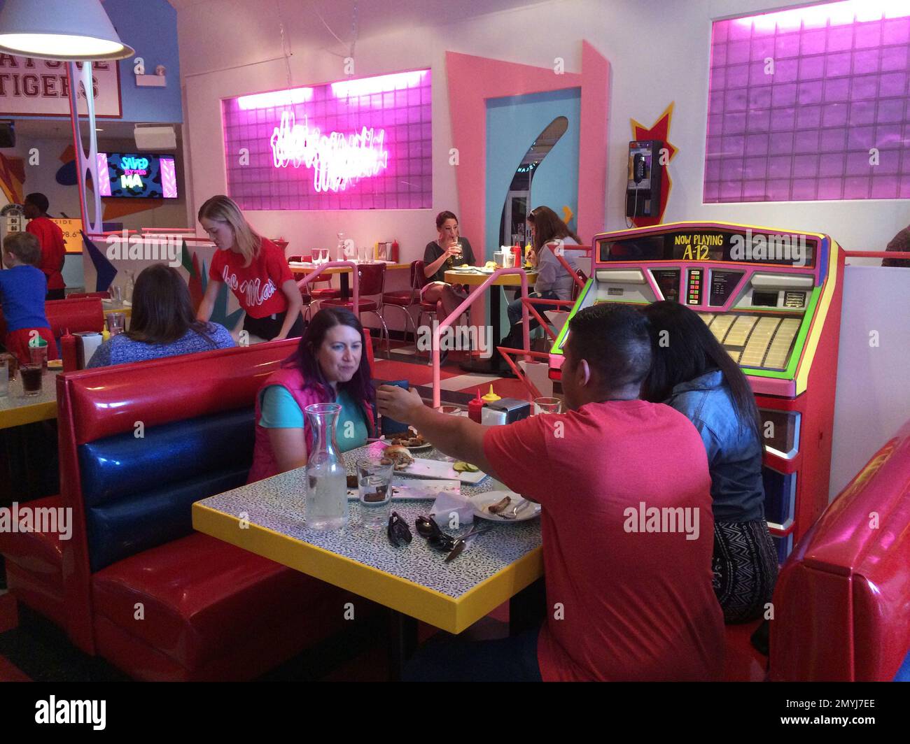 In this Wednesday, June 1, 2016 photo, customers eat at pop-up ...