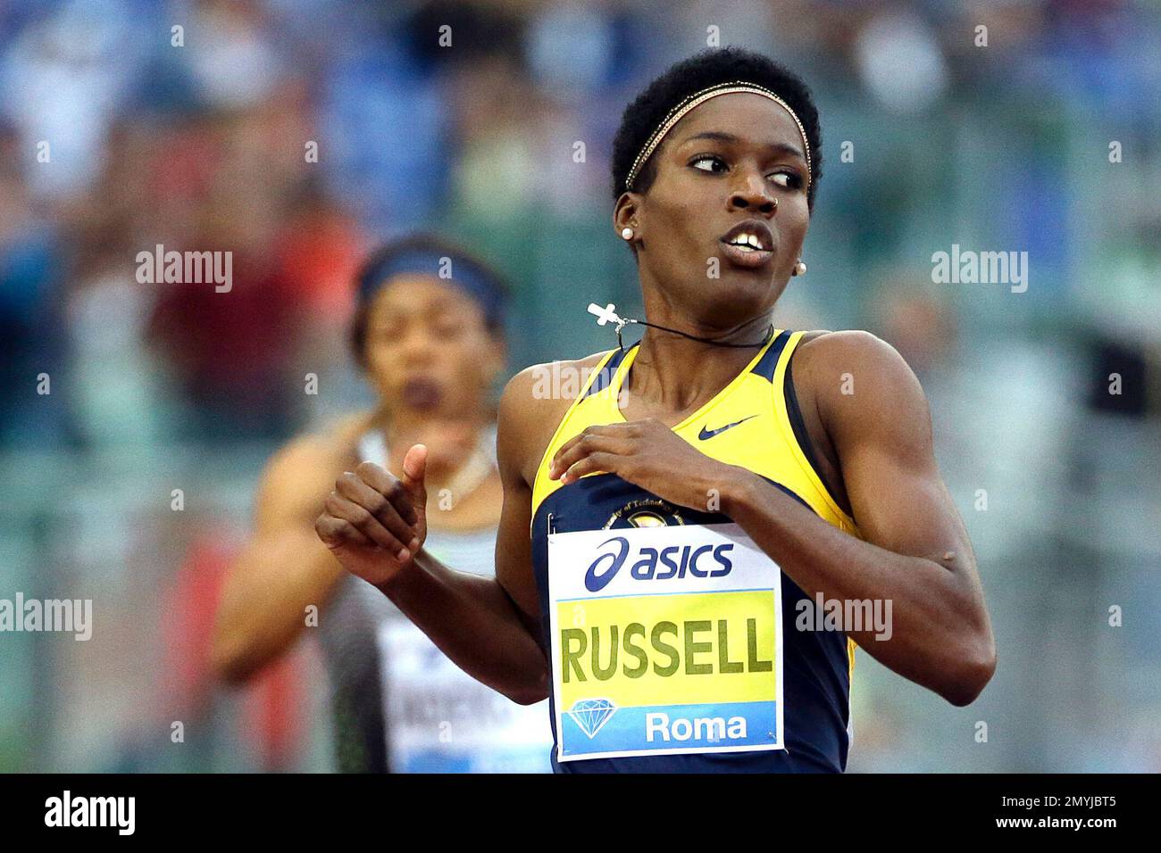 Jamaica's Janieve Russell crosses the finish line after winning the the ...