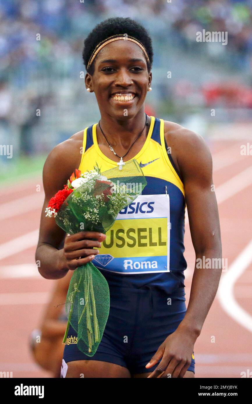 Jamaica's Janieve Russell celebrates after winning the the women's 400m ...