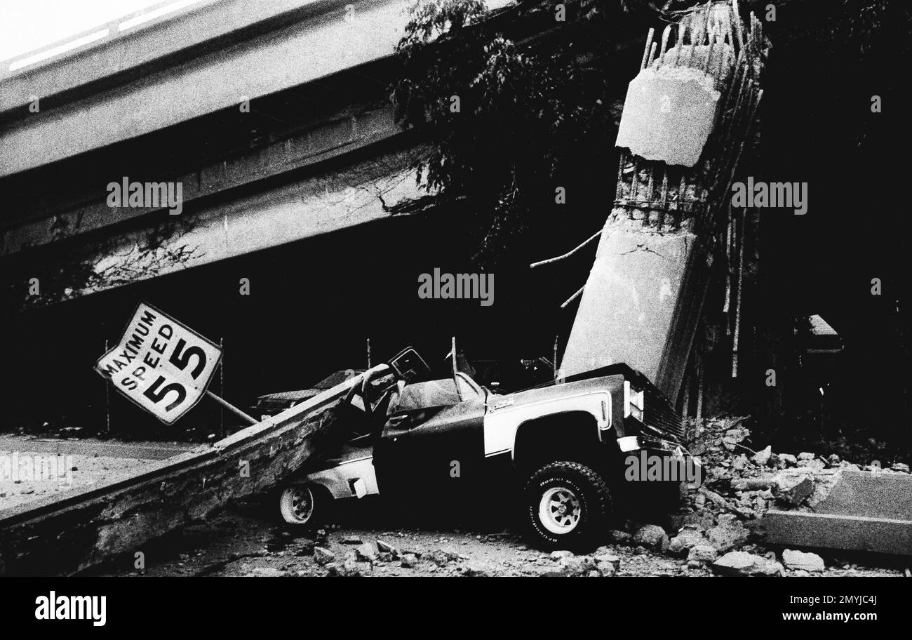 A pickup truck lies crushed under a concrete beam after the Cypress ...