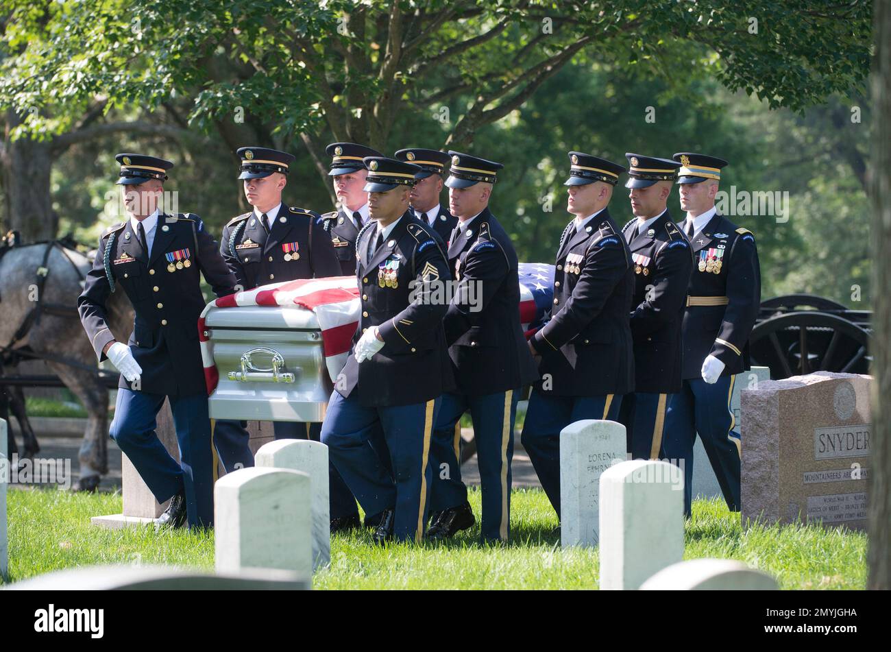 The casket of Stephanie Rader is carried during a full military honors ...