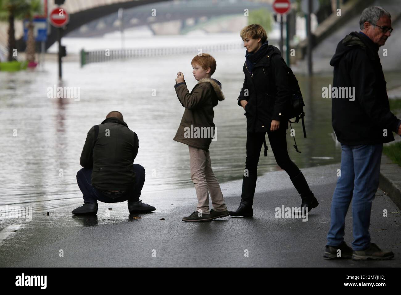 People photograph the overflowing river Seine in Paris, Wednesday, June ...