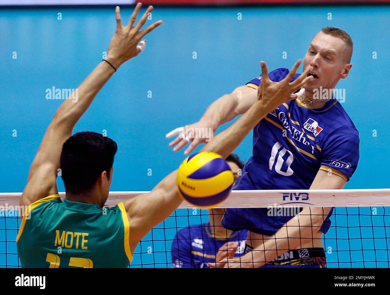 Kevin Le Roux of France spikes against Nehemiah Mote of Australia ...