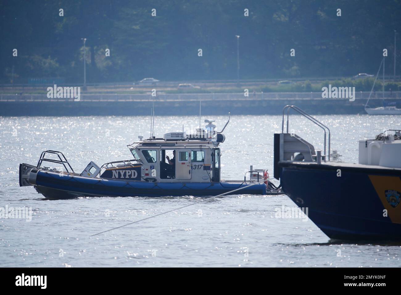 NYPD search and rescue boats sit on the Hudson River near the site of ...