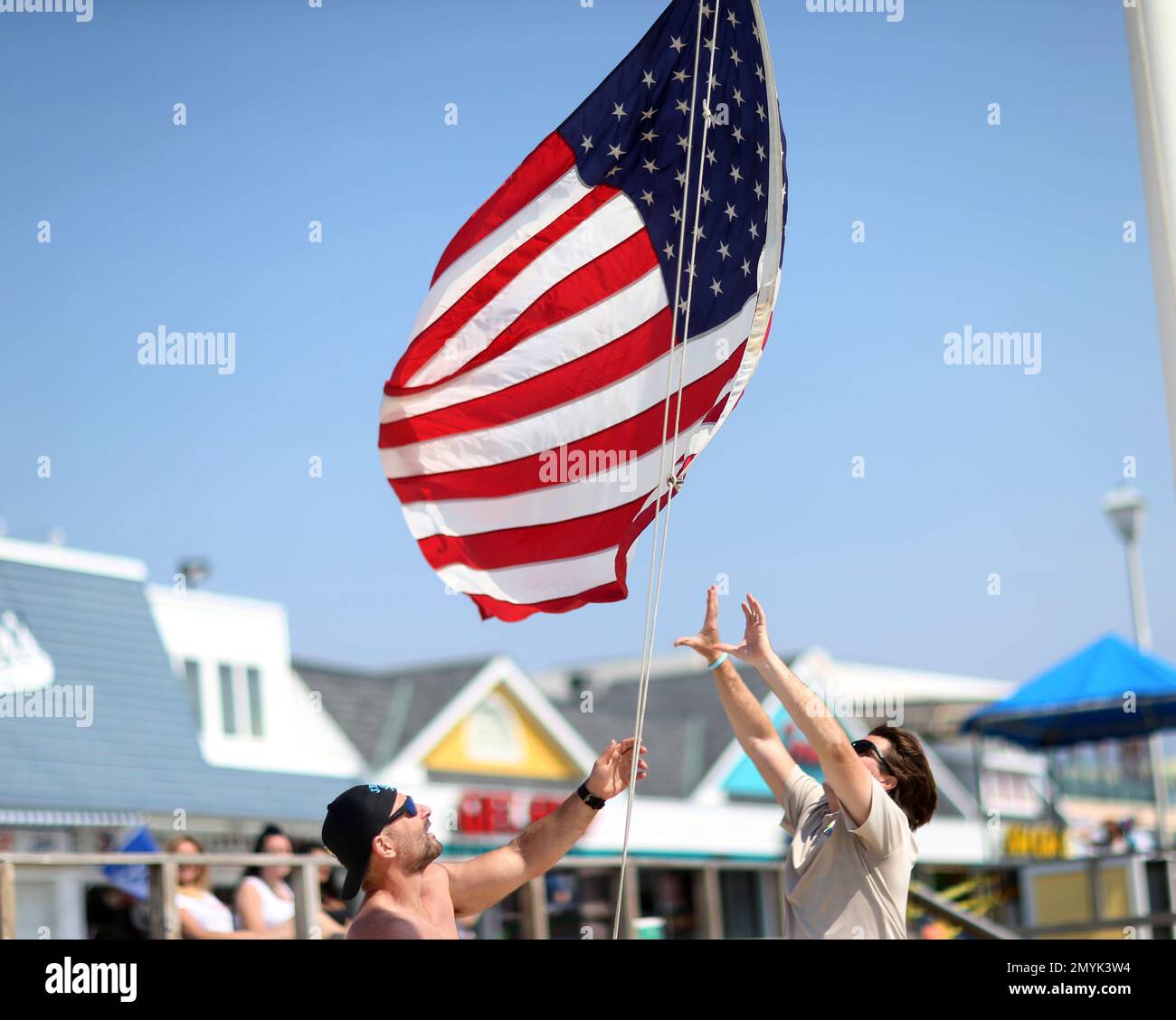 Lifeguards raise the Flag near the boardwalk to kick off the Memorial ...