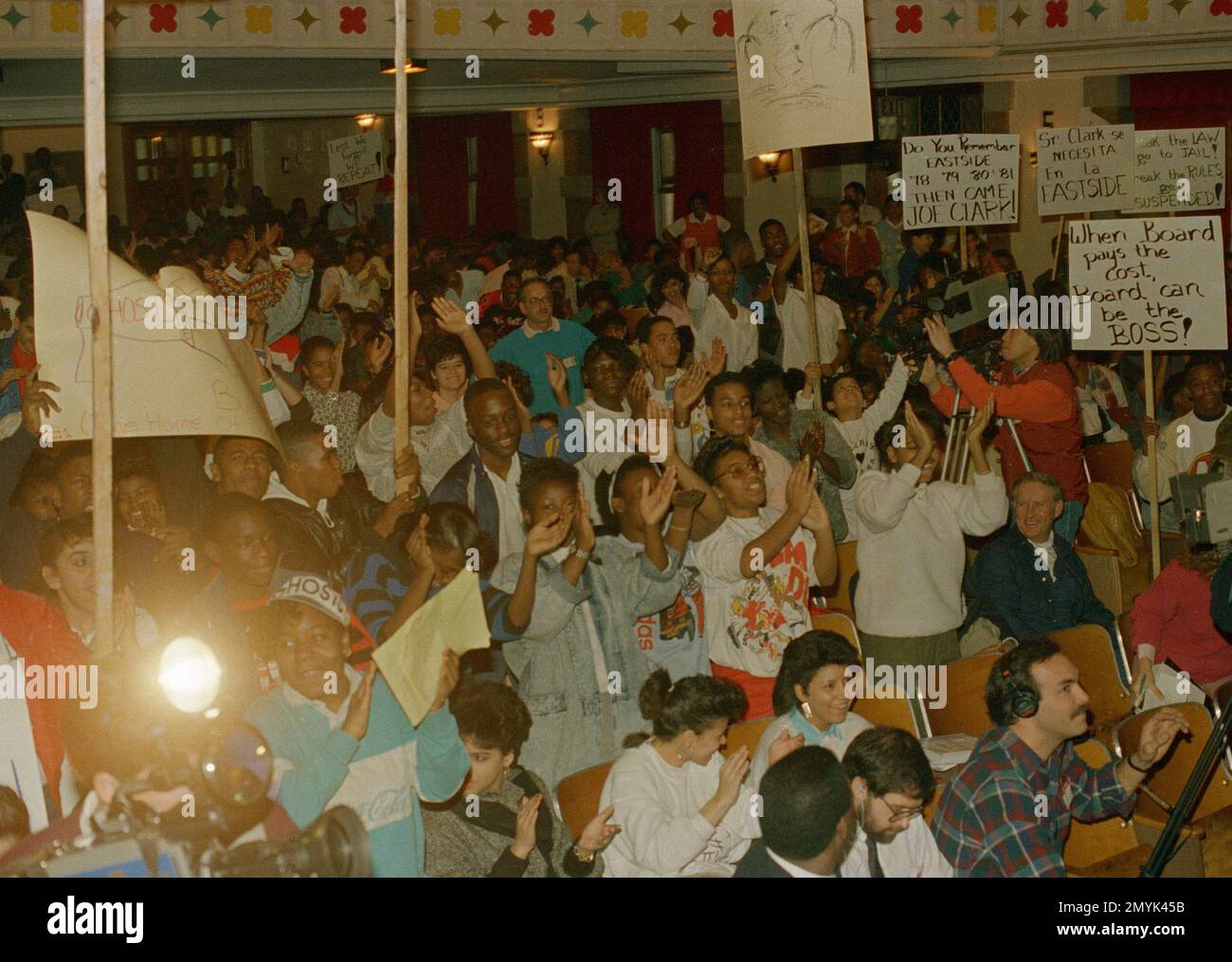 Supporters Eastside High School Principal Joe Clark cheer during a ...
