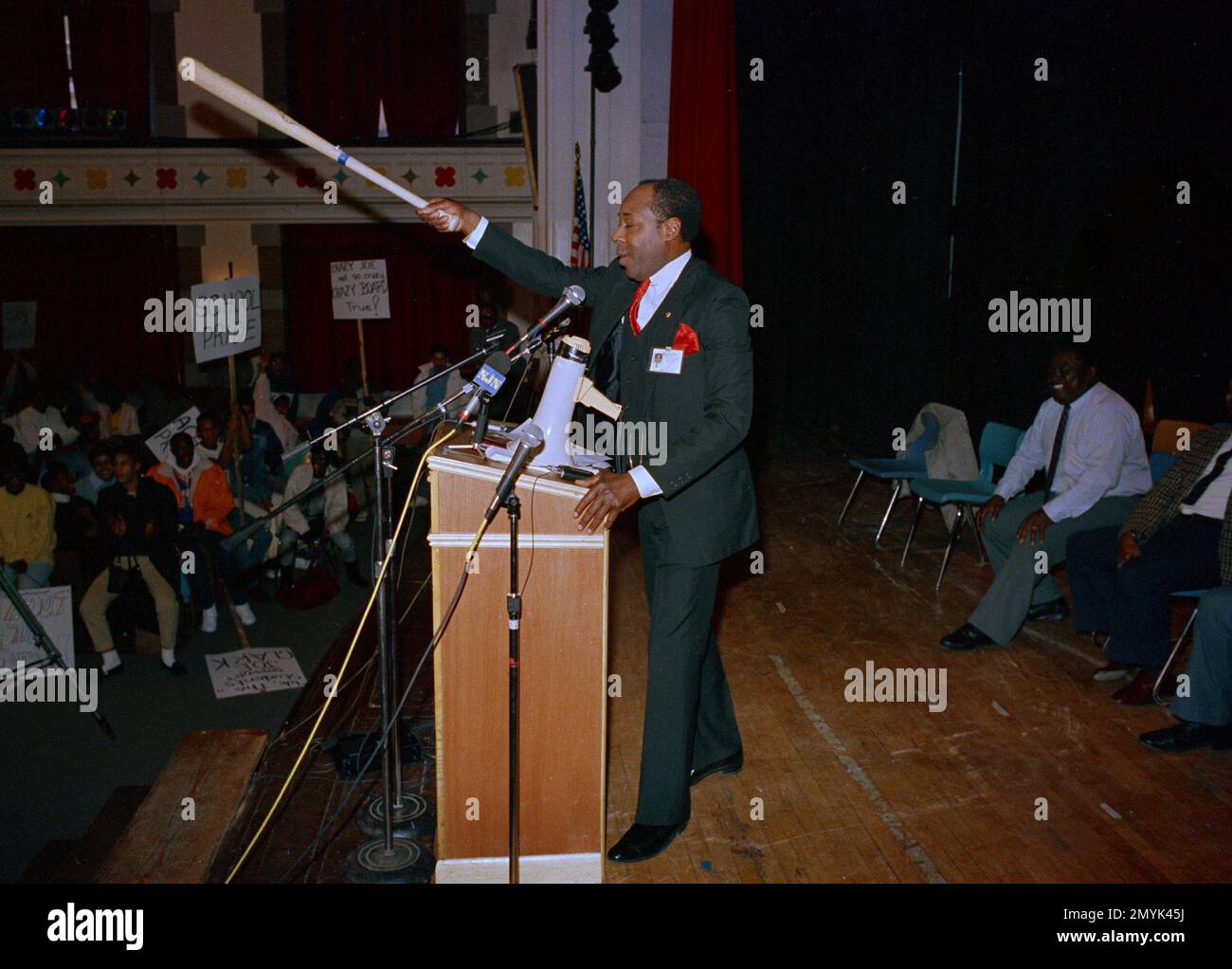Eastside High School Principal Joe Clark carries a wooden baseball bat ...
