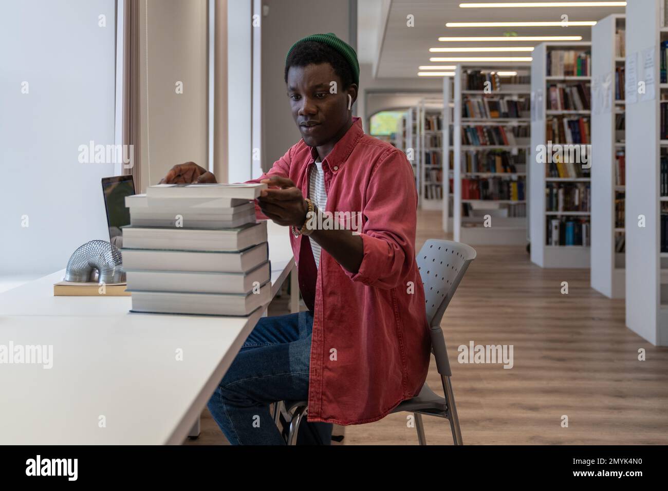 African American male university teacher preparing for online lecture ...