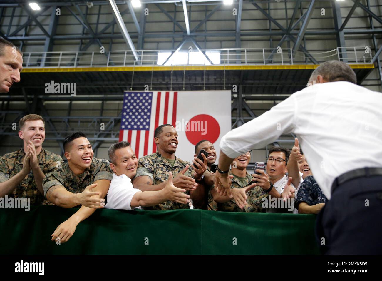 U.S. President Barack Obama reaches out to shake hands with U.S ...