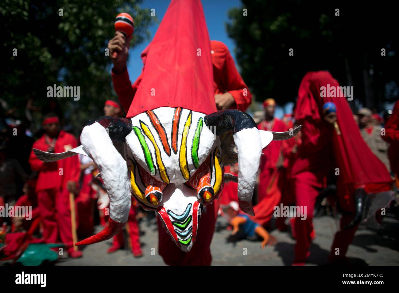 Dancing devils perform, shaking maracas during Corpus Christi ...
