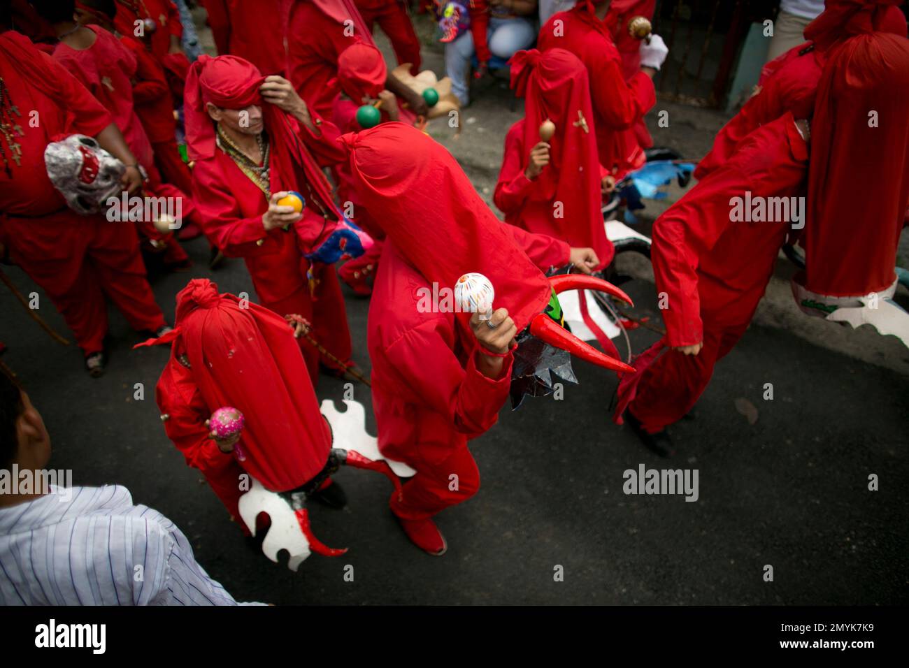 Dancing devils perform, shaking maracas during Corpus Christi ...