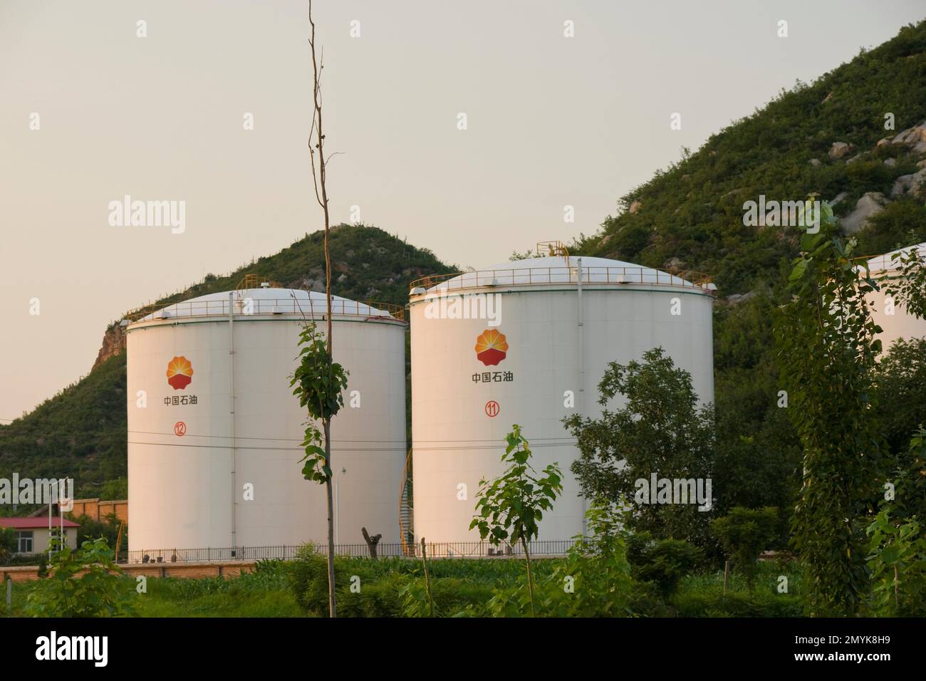 China's oil storage tanks in the mountains Stock Photo - Alamy