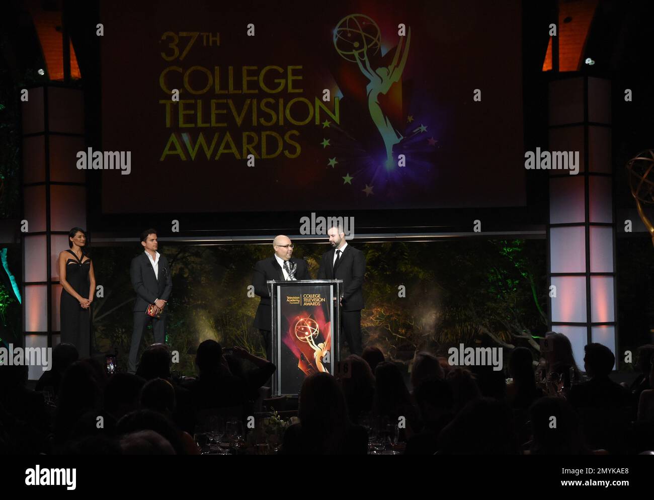 Jon Milano, left, and Christopher Naughton of Chapman University accept ...