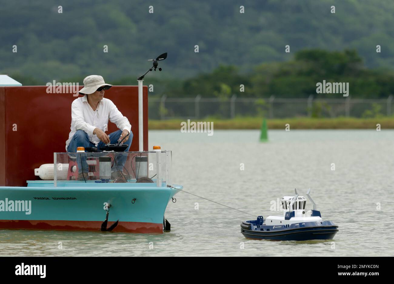A Panama Canal pilot maneuvers a miniature tugboat during a training ...