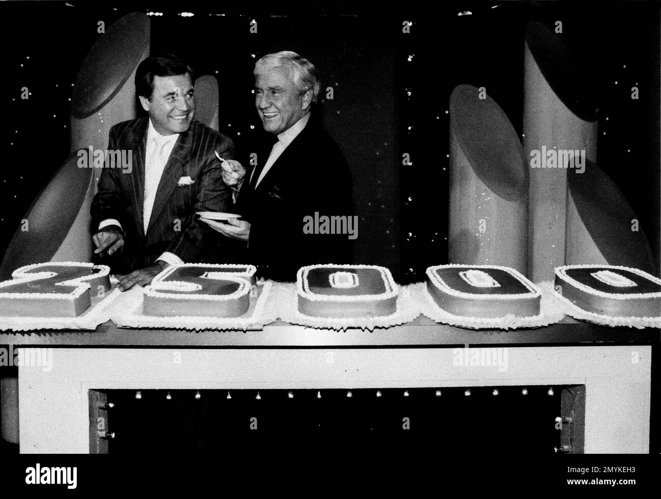 Talk show host Merv Griffin, right, and actor Robert Wagner cut a huge ...