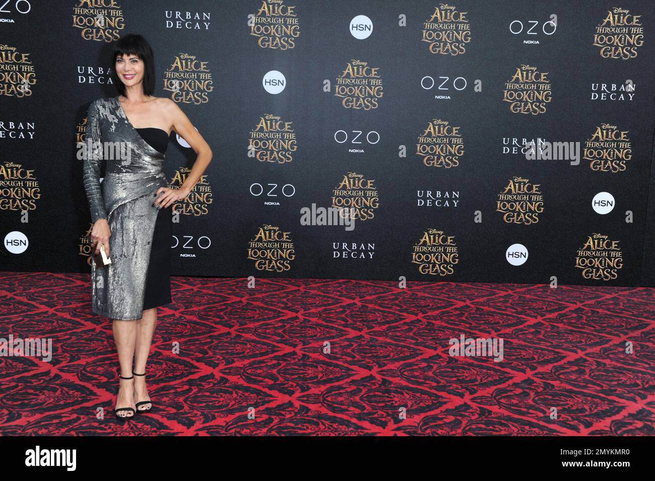 Catherine Bell arrives at the premiere of "Alice Through the Looking ...
