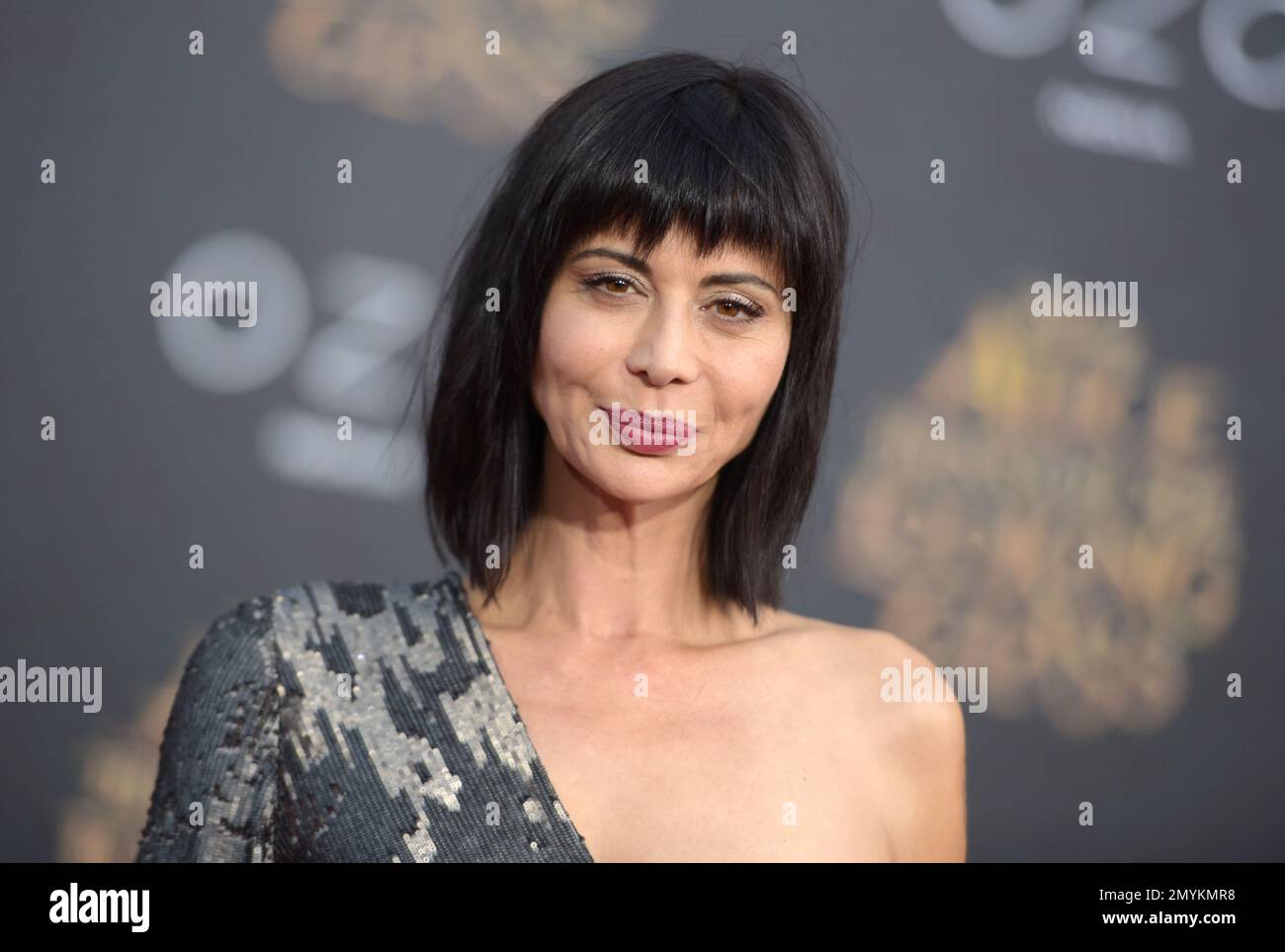 Catherine Bell arrives at the premiere of "Alice Through the Looking ...
