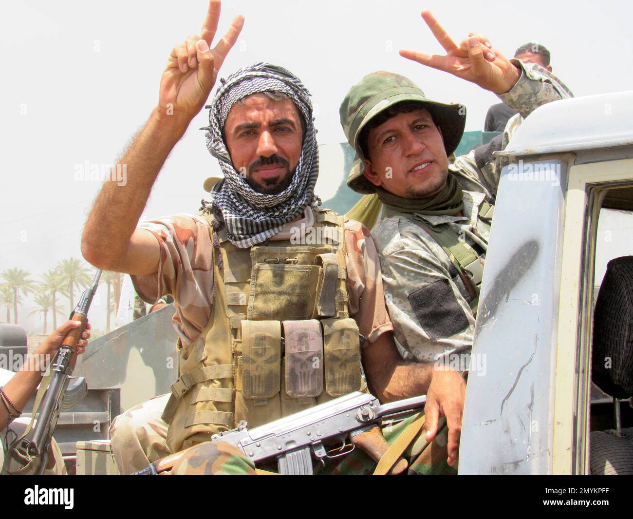 Fighters with Badr Brigades an armed Shiite group under the umbrella of ...