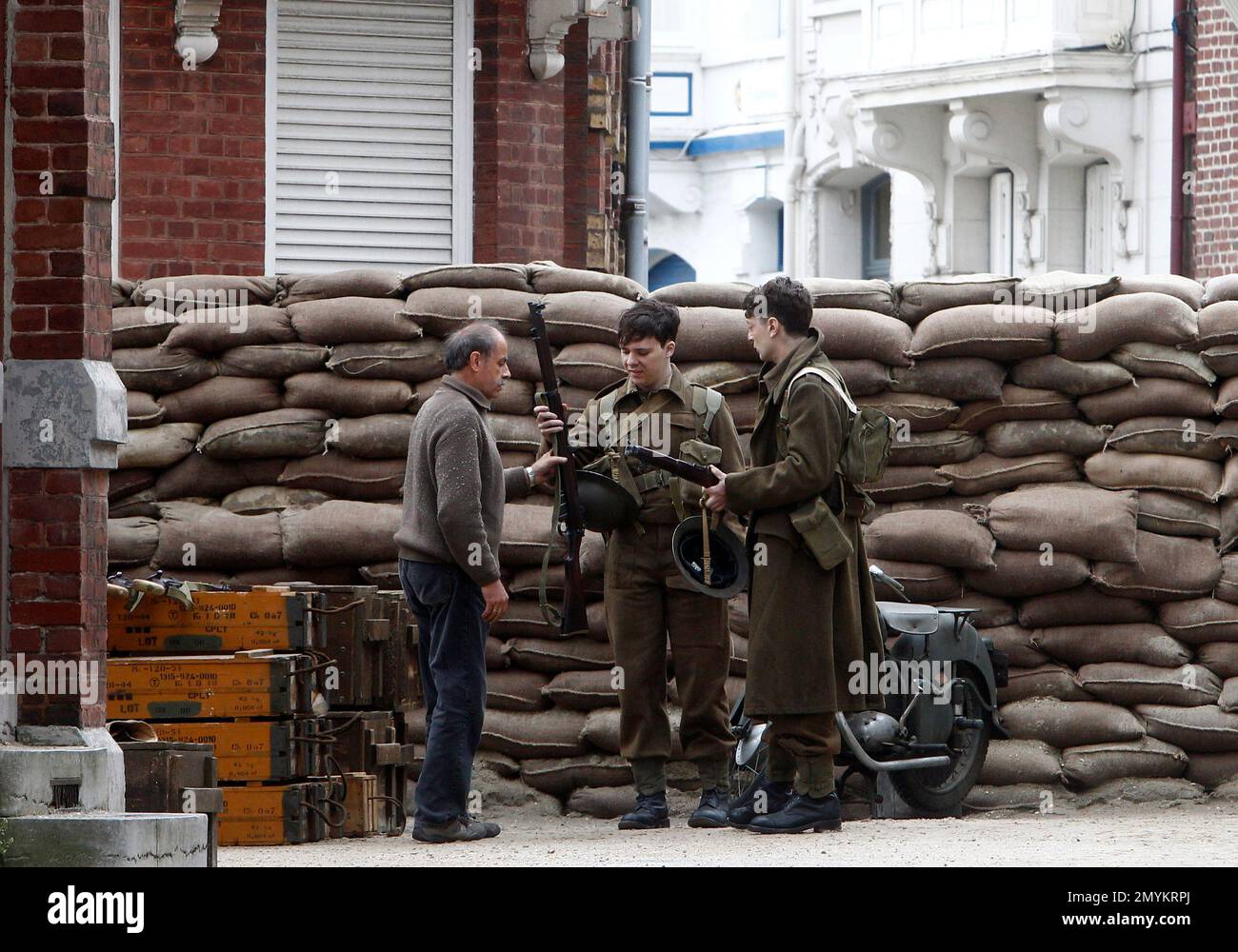 Actors wait before filming a scene for the film, "Dunkirk," in Dunkirk ...