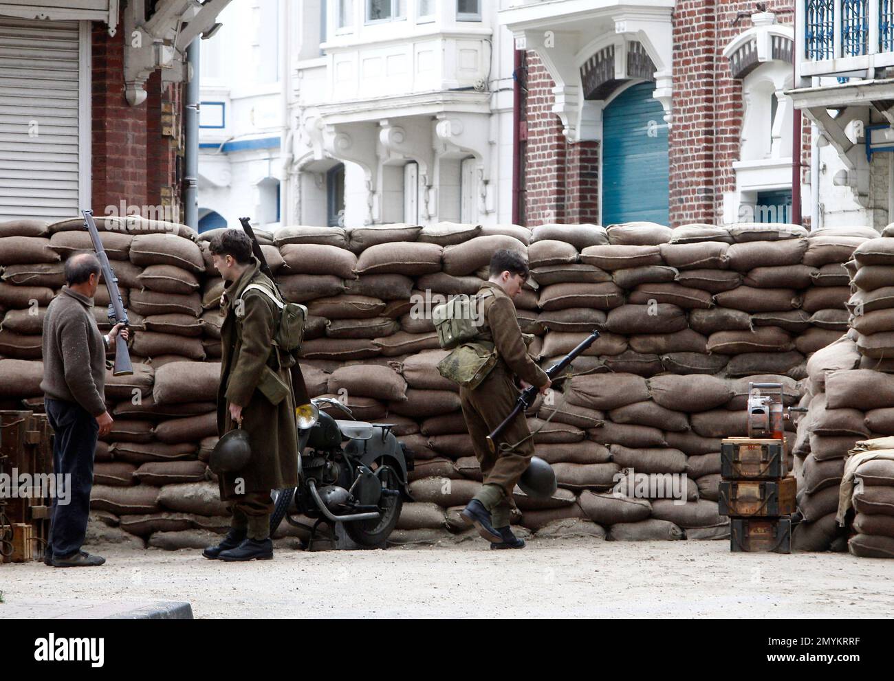 Actors wait before filming a scene for the film, "Dunkirk," in Dunkirk ...