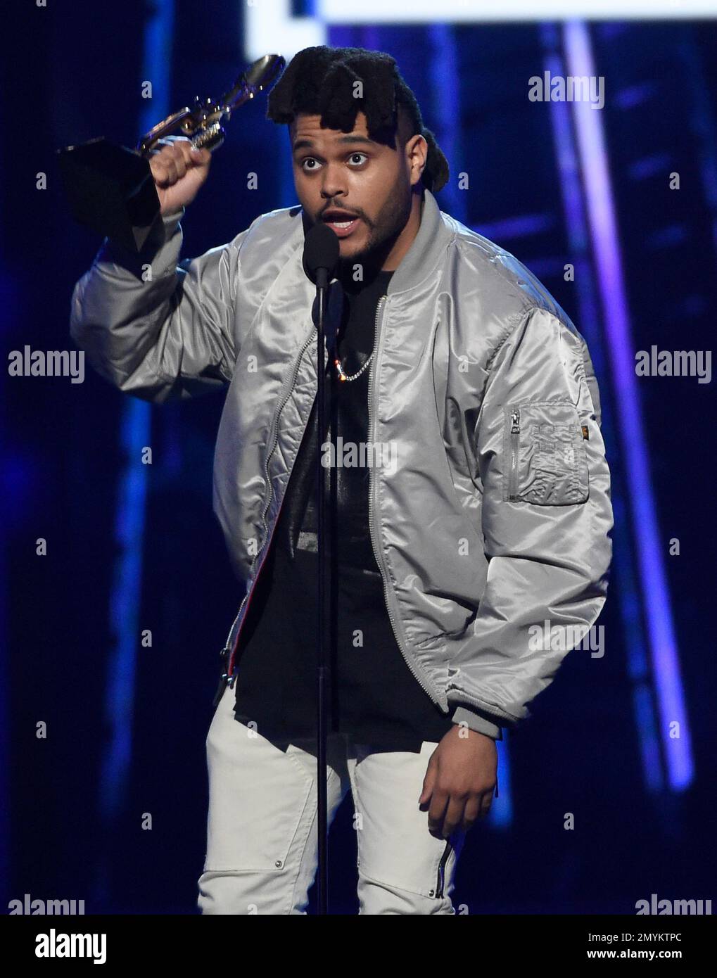 The Weeknd accepts the award for top R&B song for “The Hills” at the ...