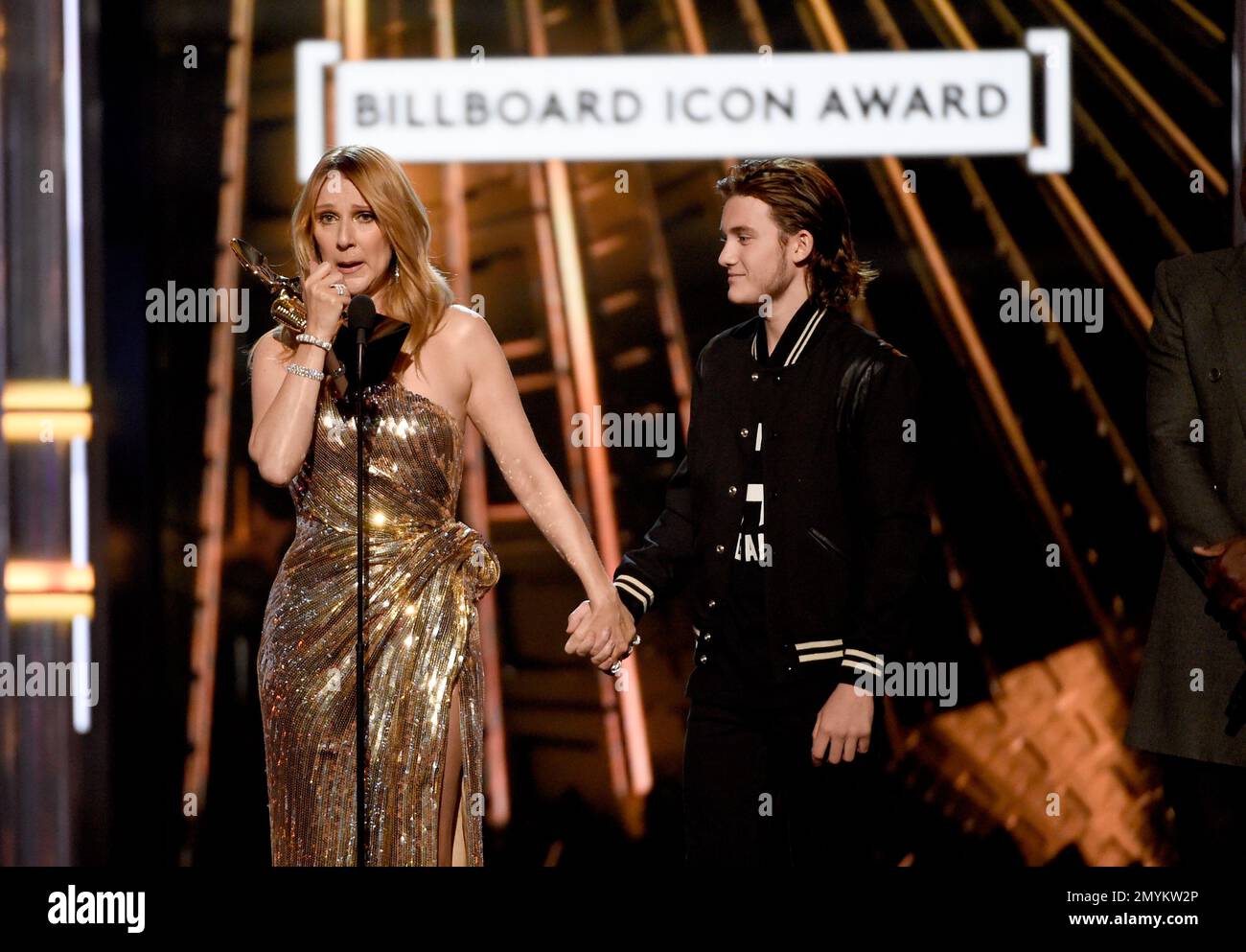 Rene-Charles Angelil presents the Icon Award to his mother, Celine Dion ...