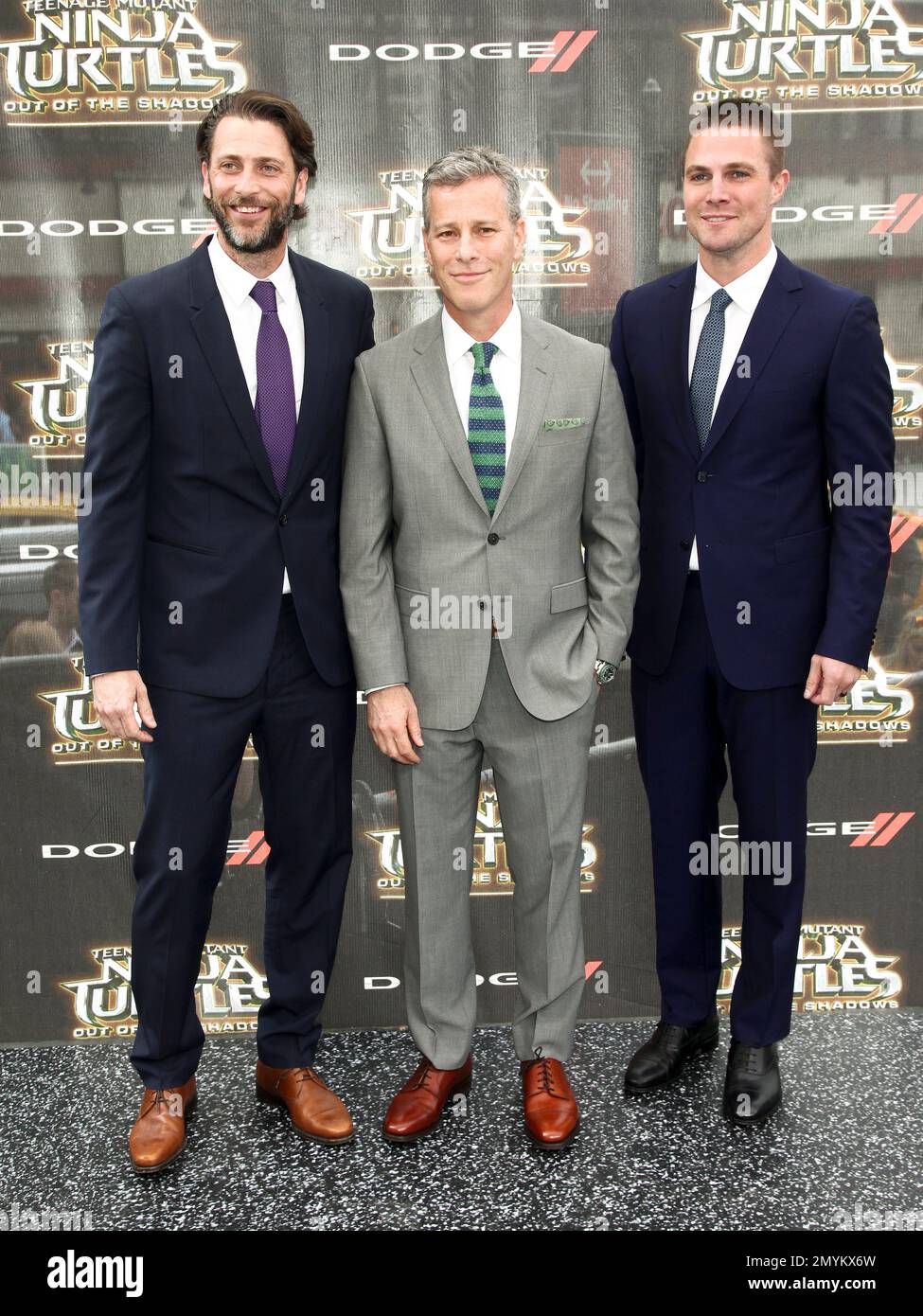 Andrew Form, from left, Brad Fuller and Stephen Amell attend the world ...