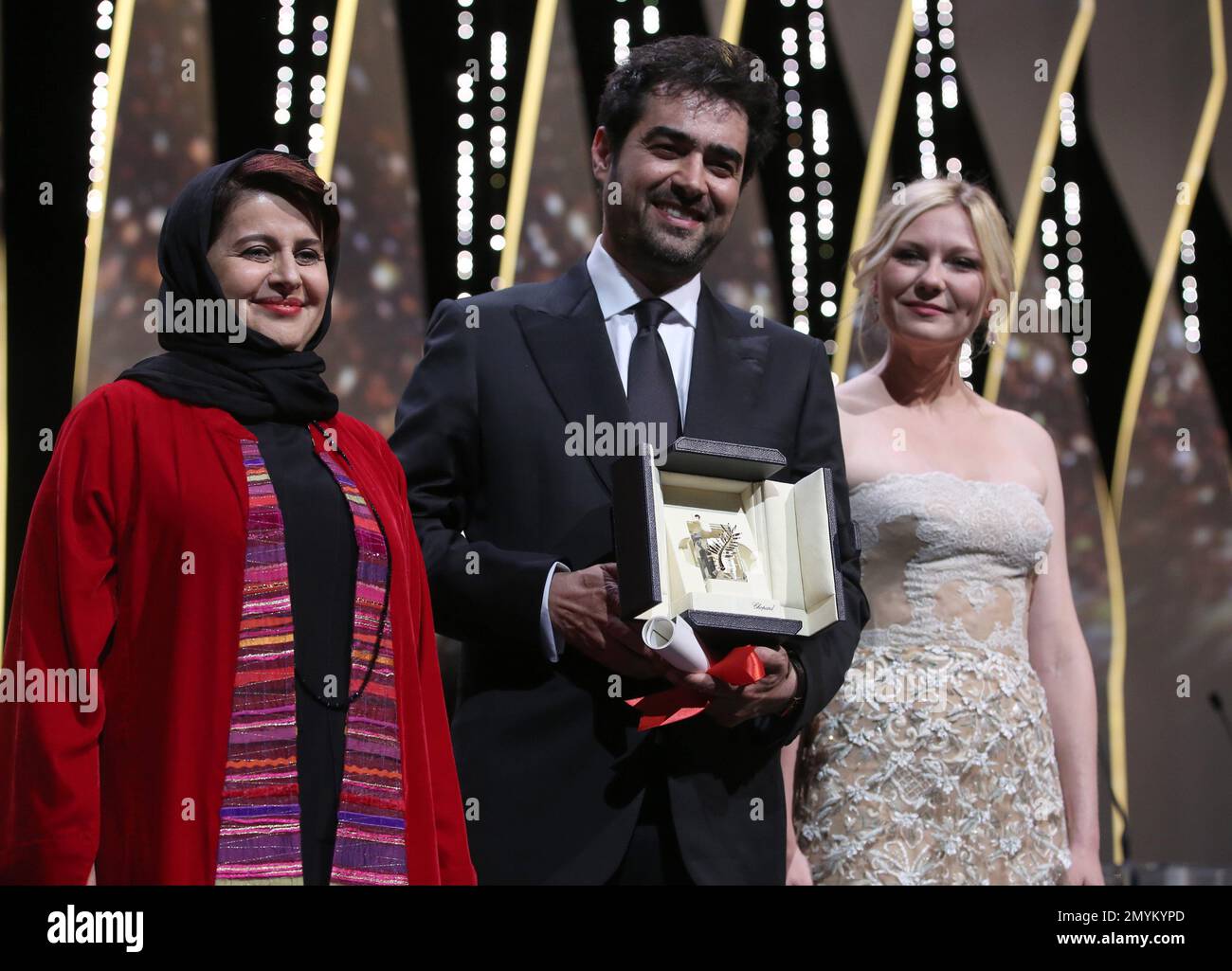 Actor Shahab Hosseini , centre, poses for photographers after winning ...