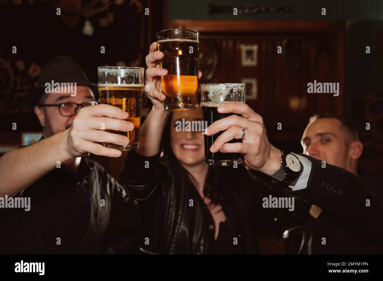 Hand holding beer mug three hi-res stock photography and images - Alamy