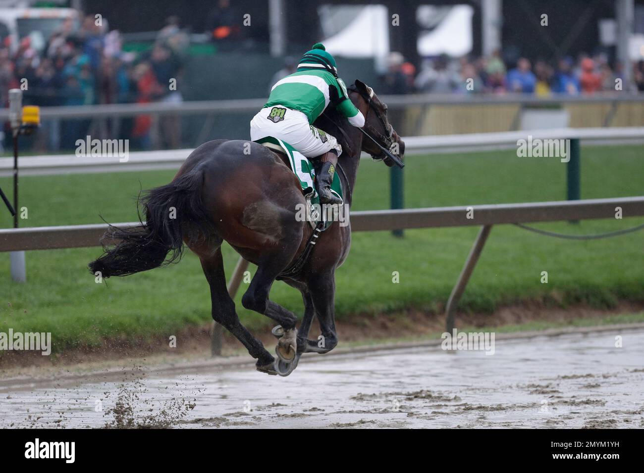 Exaggerator with Kent Desormeaux aboard moves to the finish line during ...
