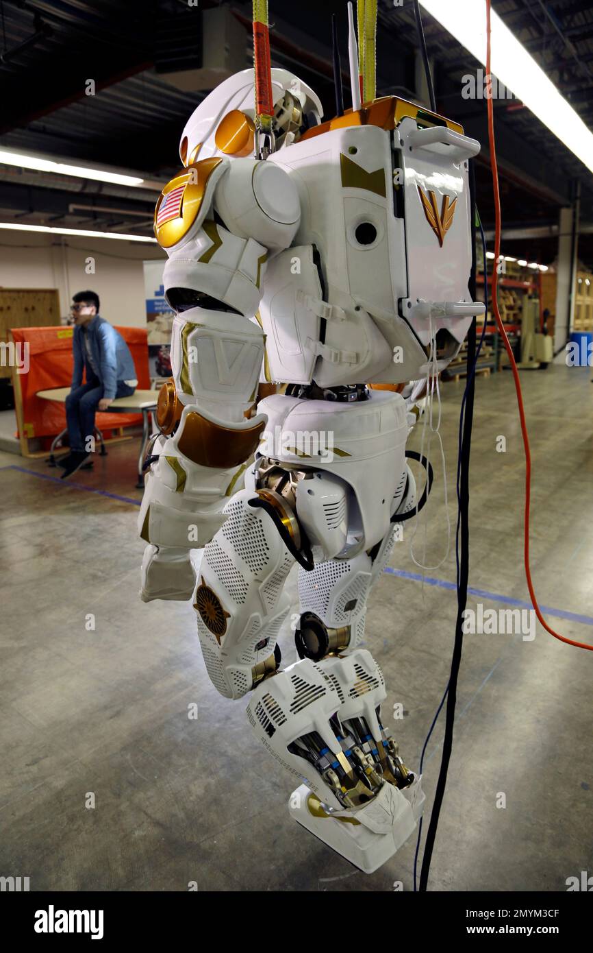 In this May 2, 2016 photo, researchers watch a six-foot-tall, 300-pound Valkyrie robot stand at ...