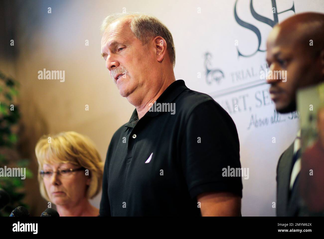 Kevin Sherman, center, speaks while standing next to his wife Mary Ann ...