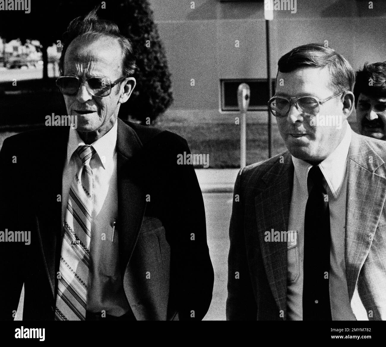 Posse Comitatus leader James Wickstrom, right, is led from the Shawano ...
