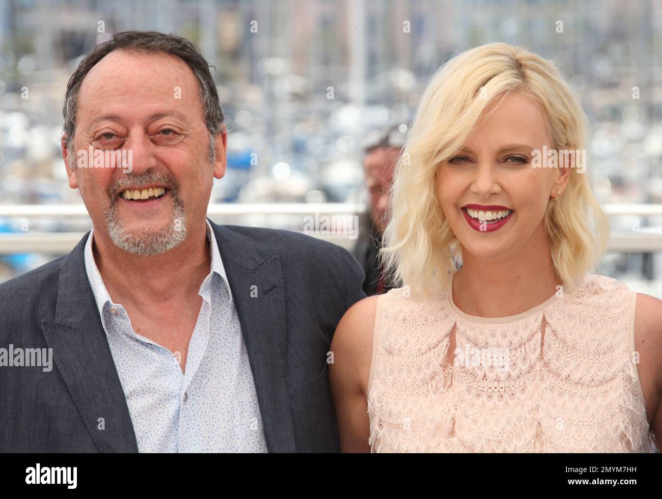 Actors Jean Reno and Charlize Theron pose for photographers during a ...