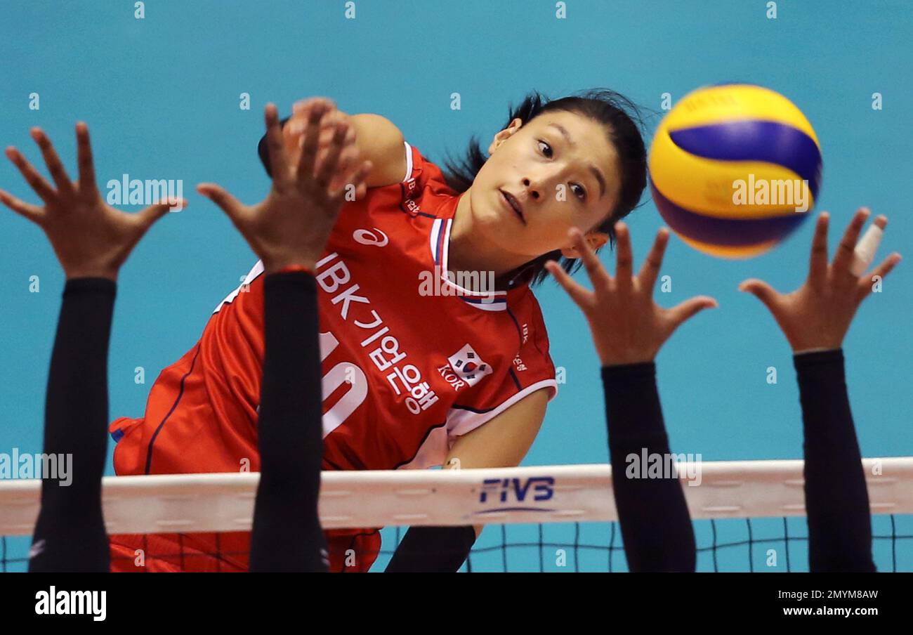 Kim Yeon-koung of South Korea spikes the ball against Peru during their ...