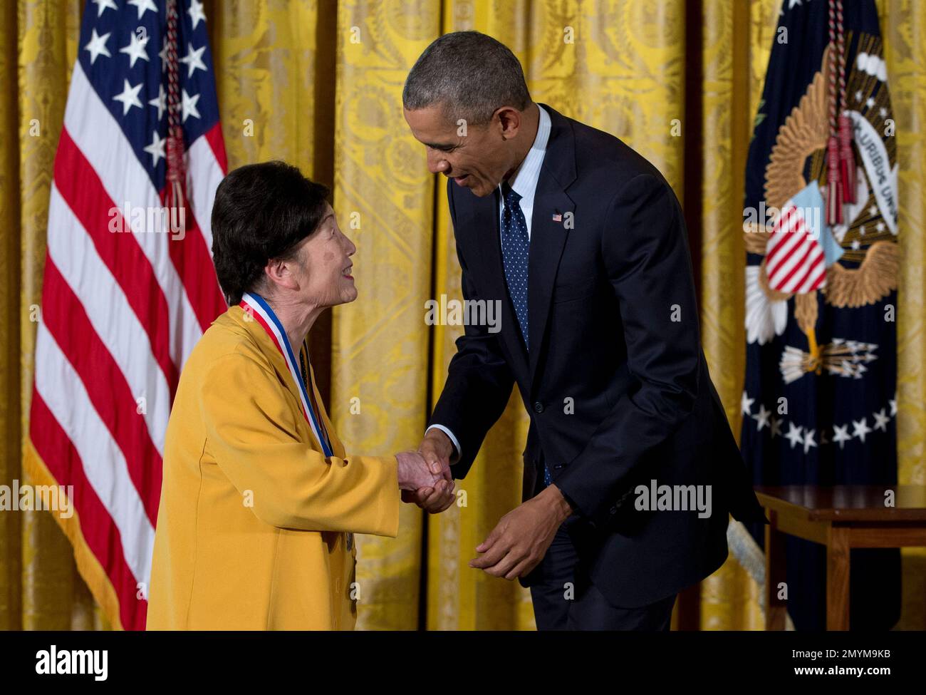 President Barack Obama shakes hands with Dr. Nancy Ho of Green Tech ...