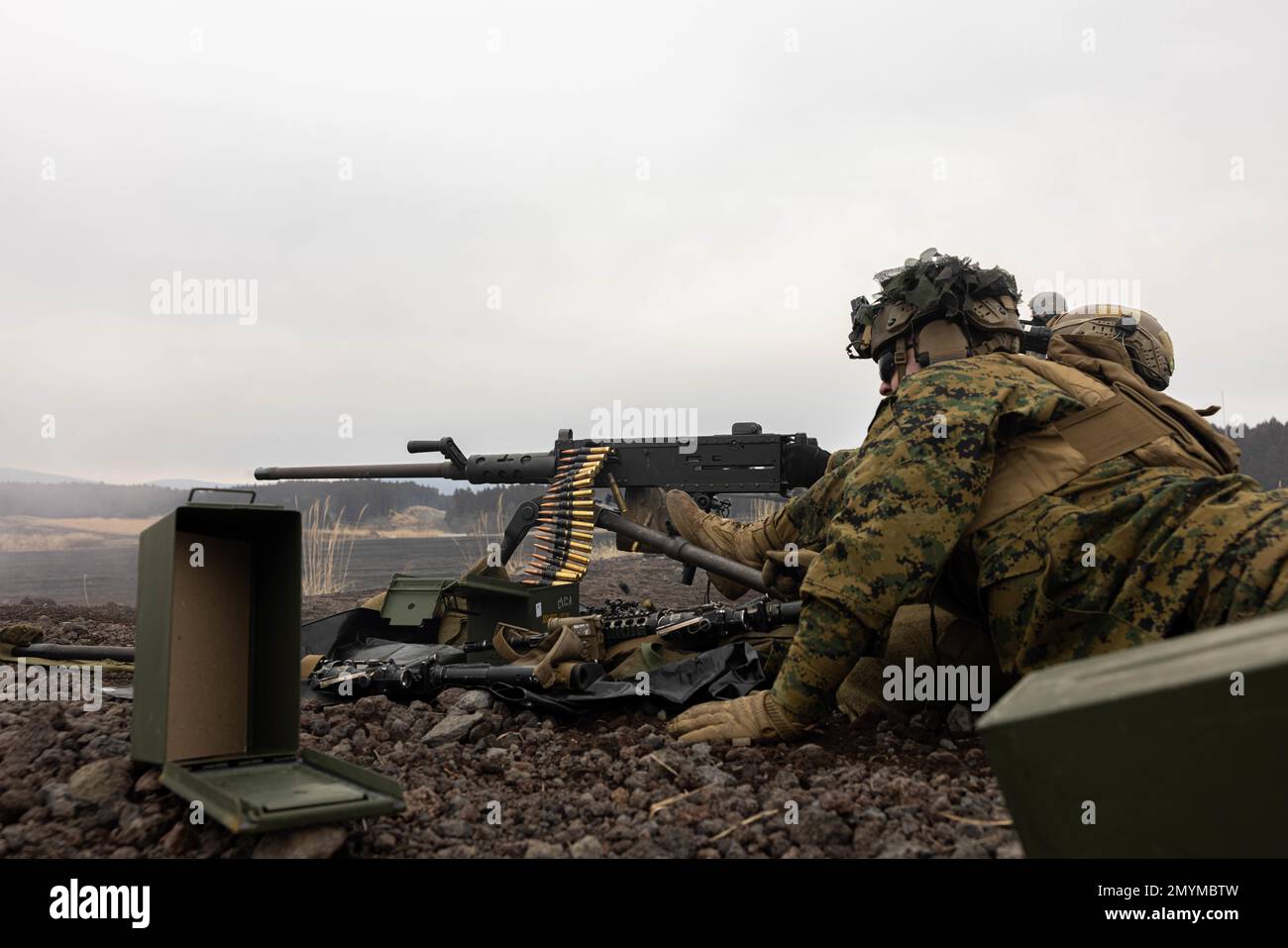 U.S. Marines with 3d Battalion, 4th Marines fire an M2A1 machine gun ...