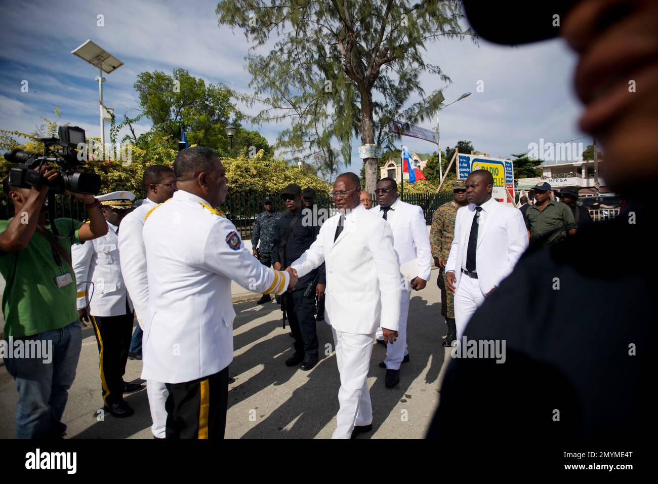 Interim President Jocelerme Privert, center, greets interim director of ...