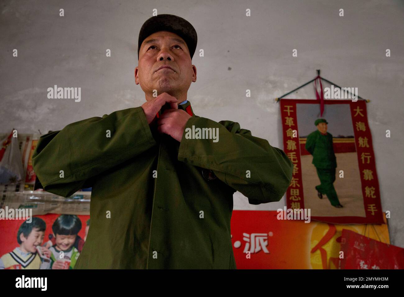 In this May 2, 2016 photo, Zhao Shunli puts on his uniform in his home ...