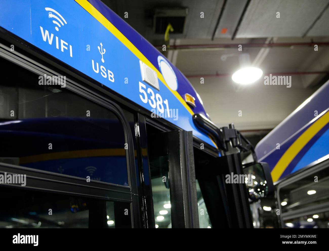 A new MTA bus displays symbols for WiFi and charging ports during a ...